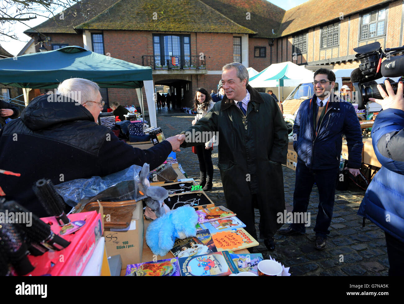 Ukip Leader Nigel Farage (centre) meets market stall holder Frank ...