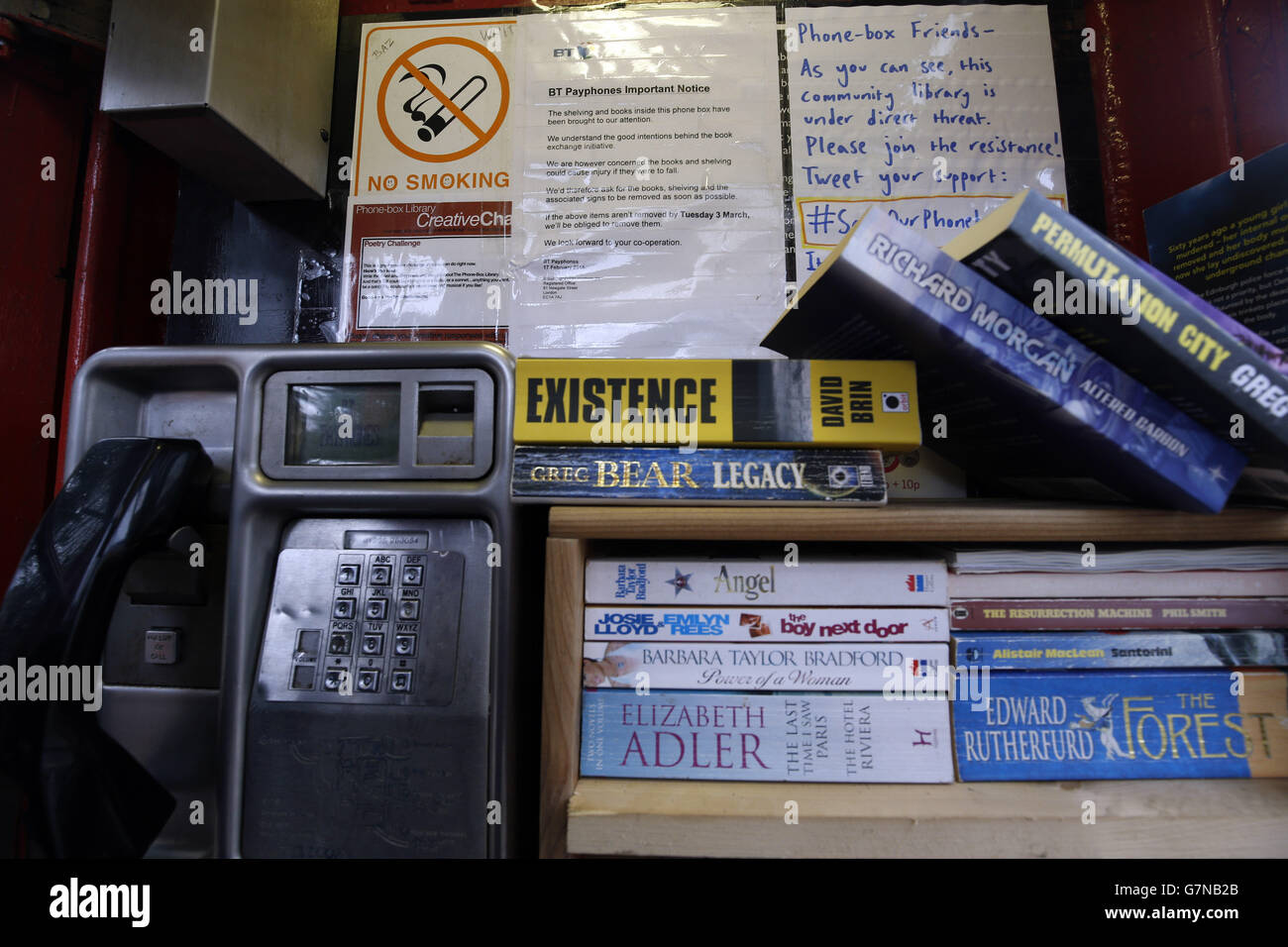 A view of the interior of the red phone box which has been turned into ...