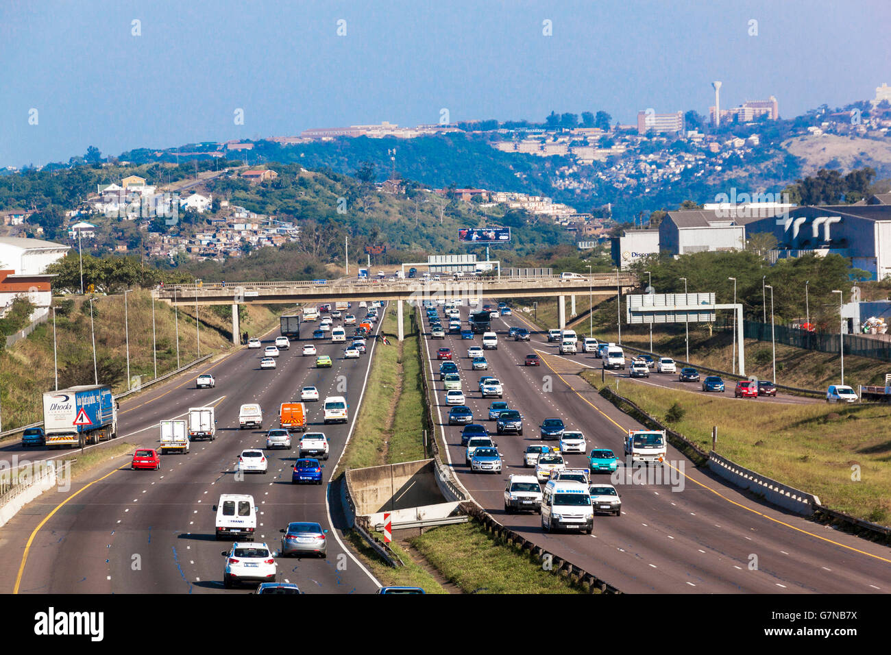 Many vehicles head north and south at mid day on the N2 highway at ...