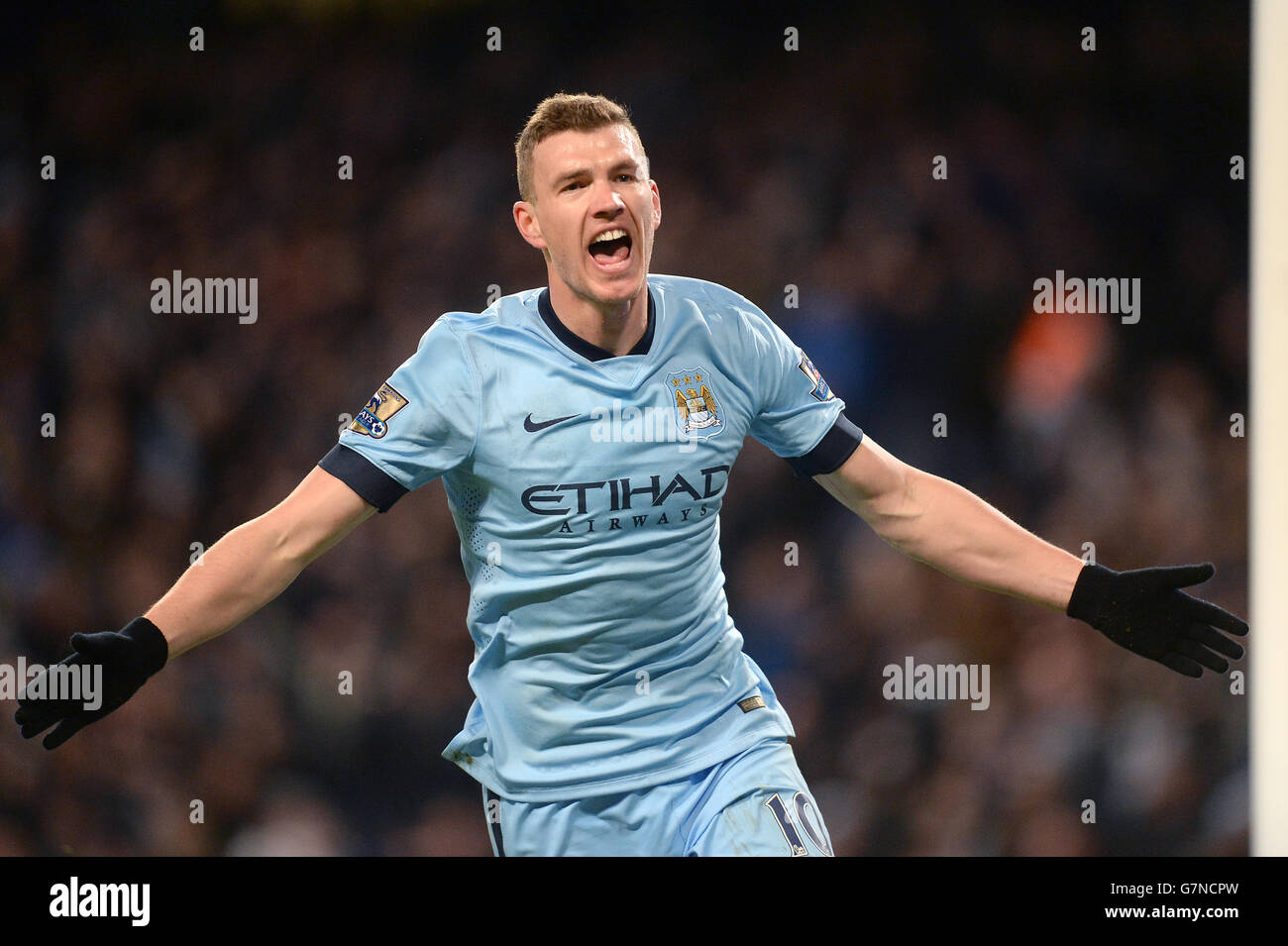 Manchester City's Edin Dzeko celebrates scoring his sides third goal of ...