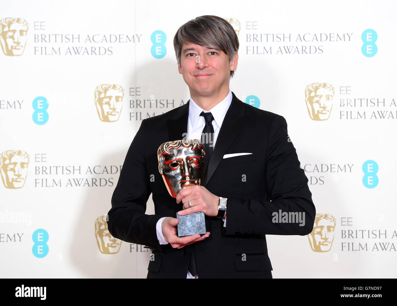 Tom Cross with the Editing Award for Whiplash, at the EE British ...