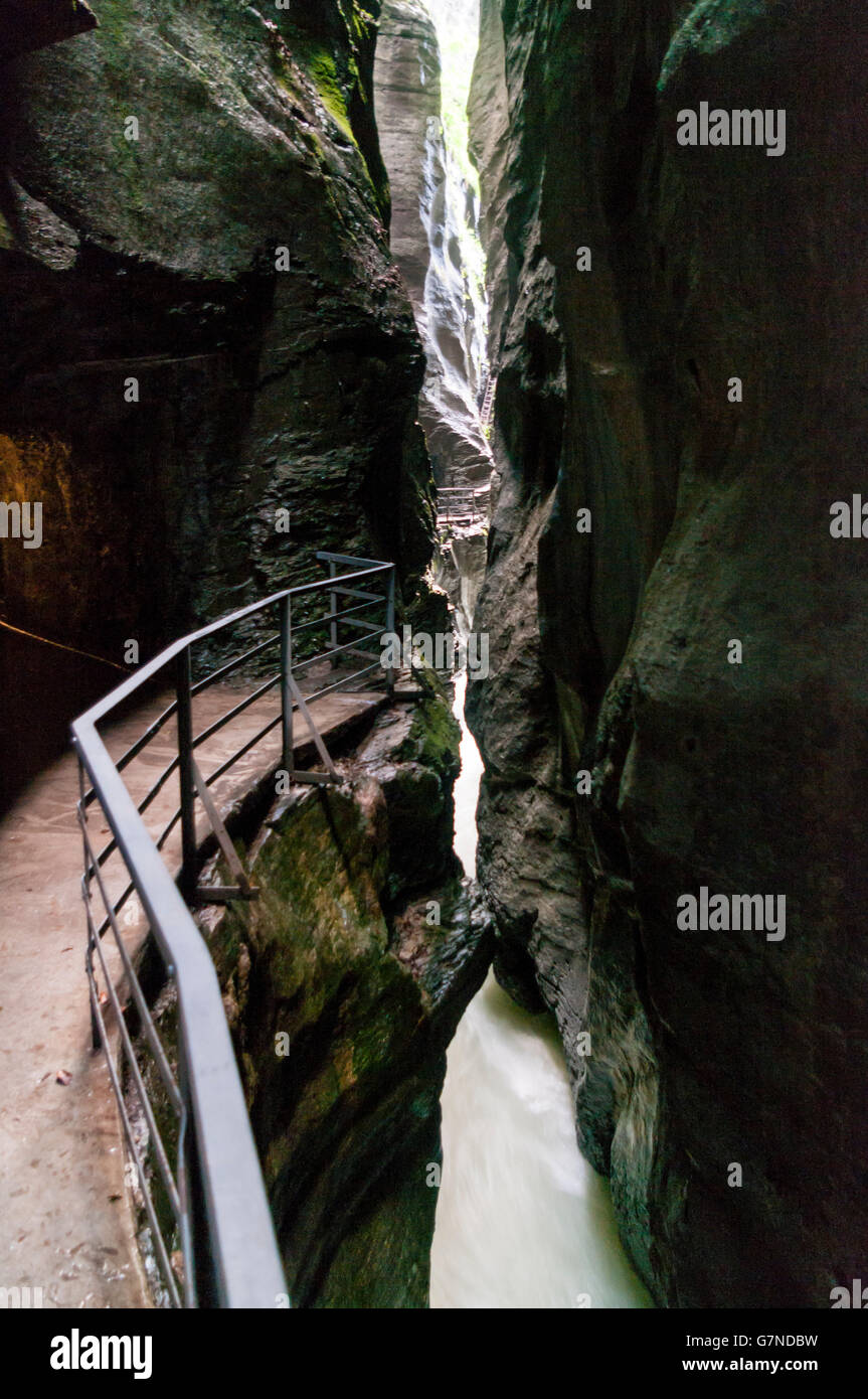 Aareschlucht, a gorge of Aare river carved deep into limestone, with up ...