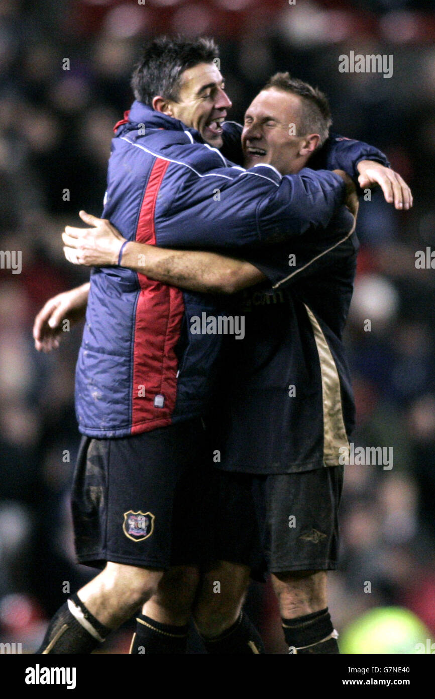 Exeter City captain Sean Devine (R) celebrates with team mate Steve ...