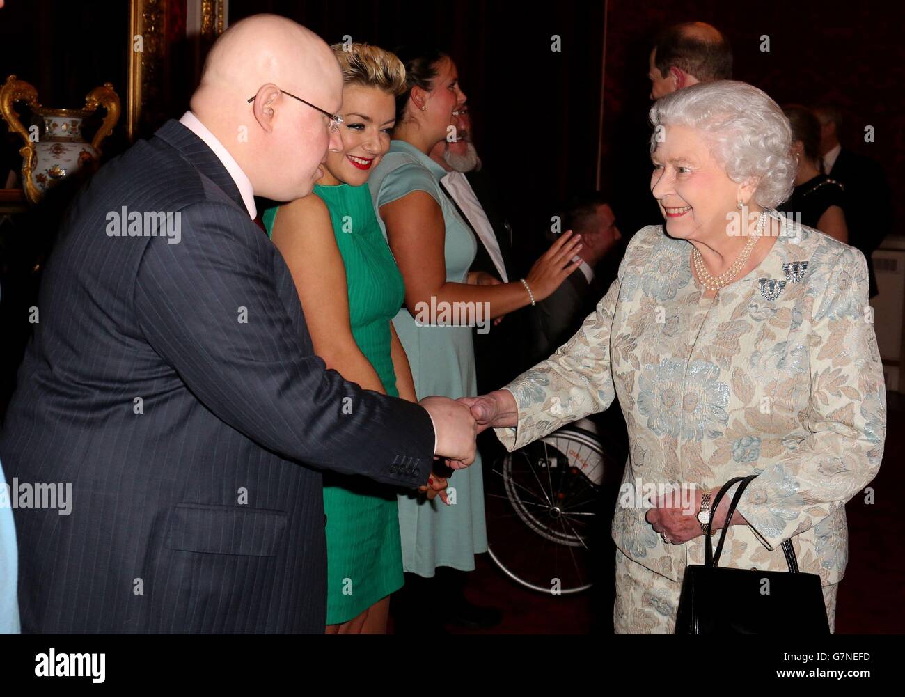 Queen Elizabeth II meets actor Matt Lucas during a reception at ...