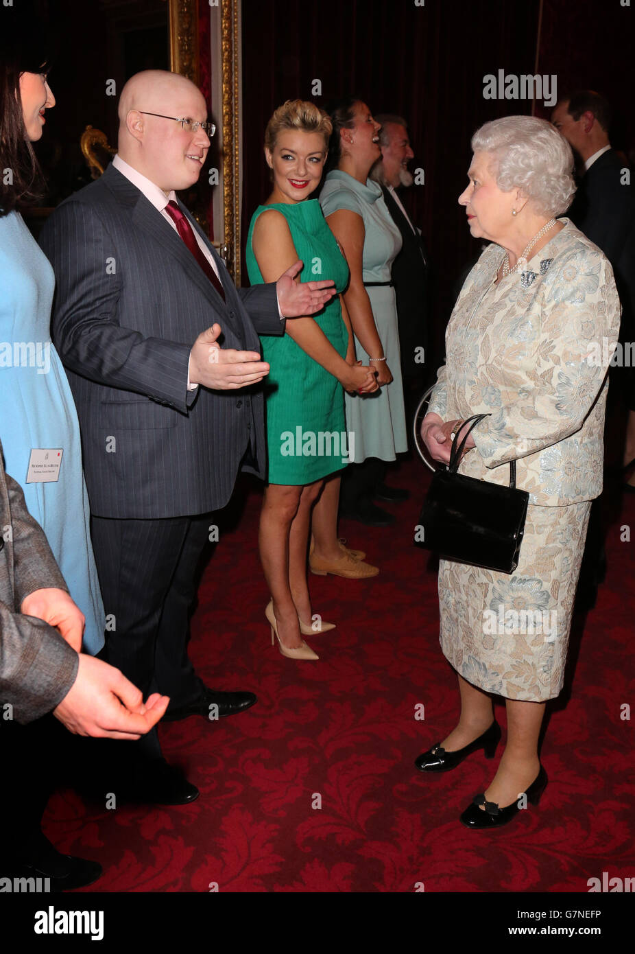 Queen Elizabeth II meets actor Matt Lucas (left) during a reception at ...