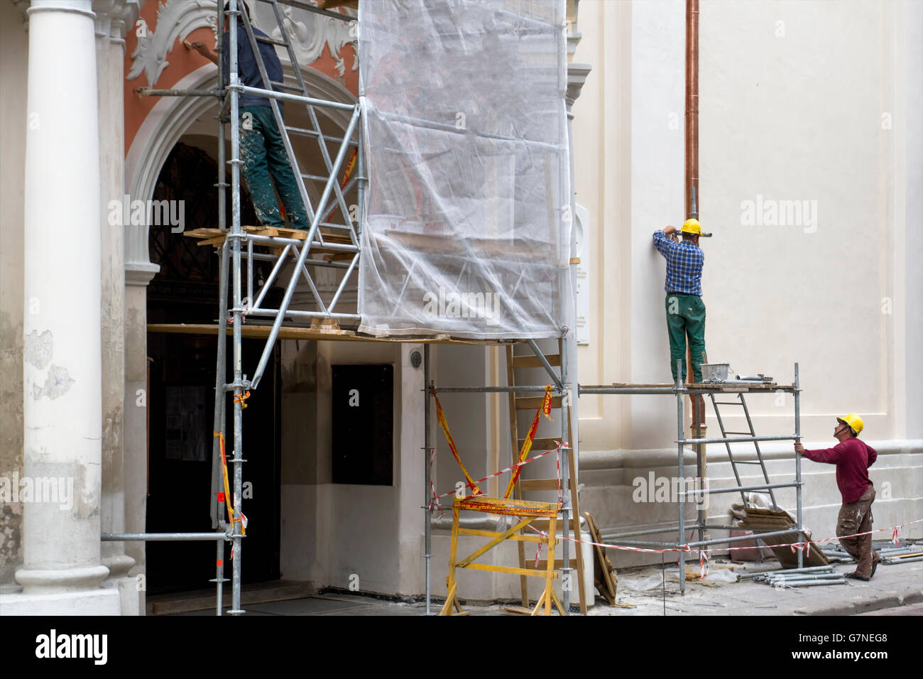 Restoration of the old building. Construction workers at work Stock ...