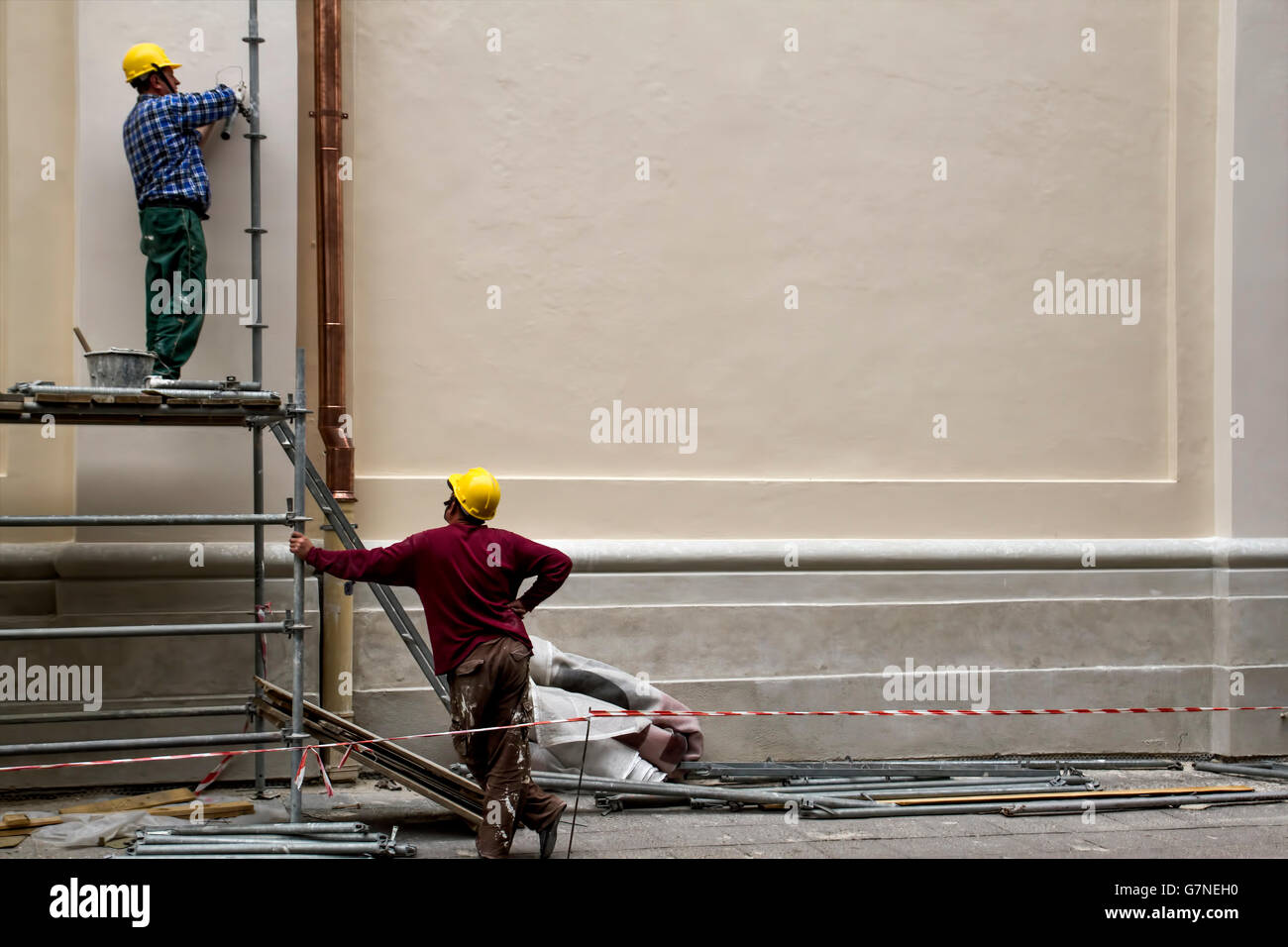 Restoration of the old building. Construction workers at work ...