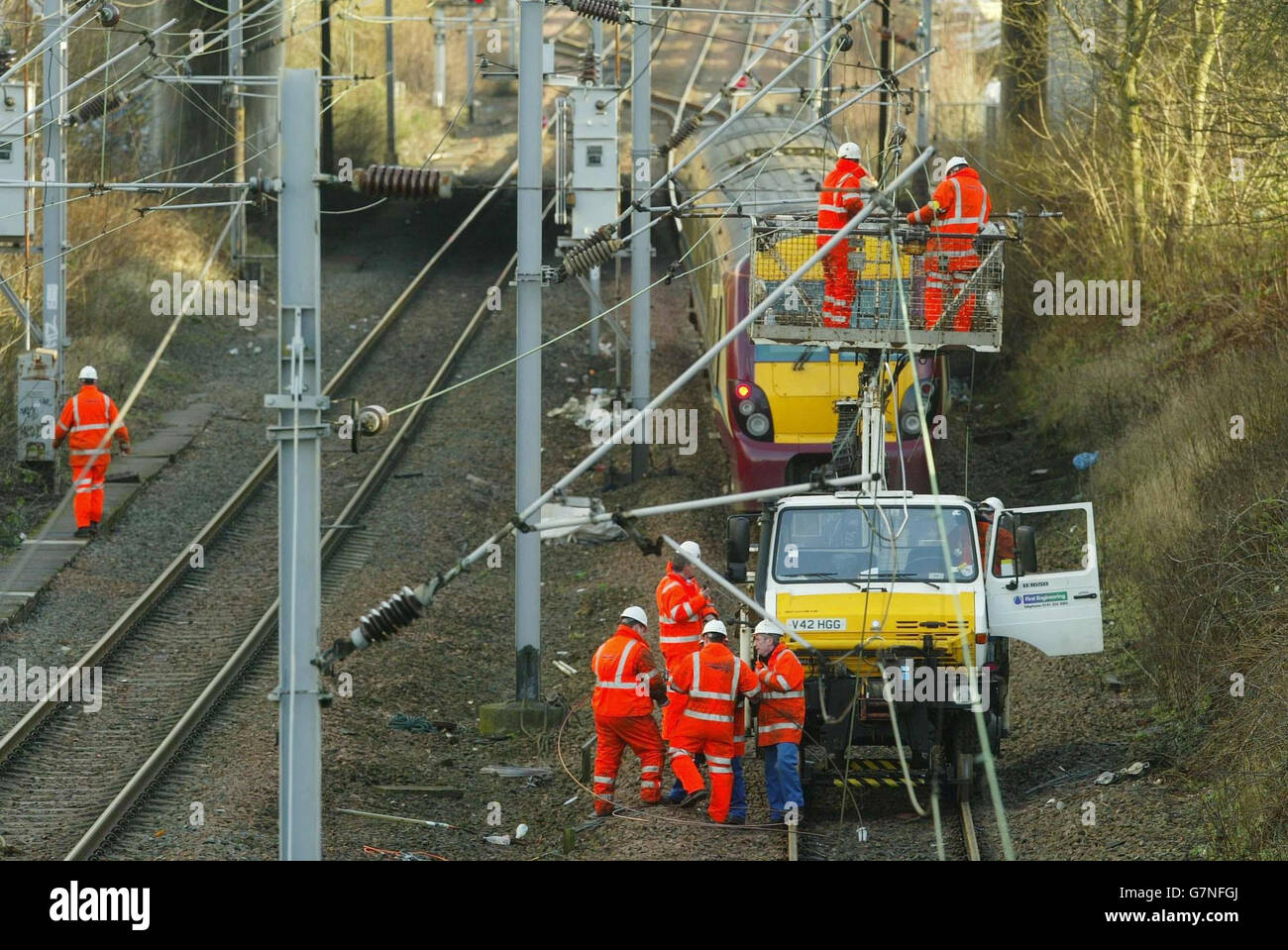 Network Rail workers fixing downed power lines on the Glasgow to ...