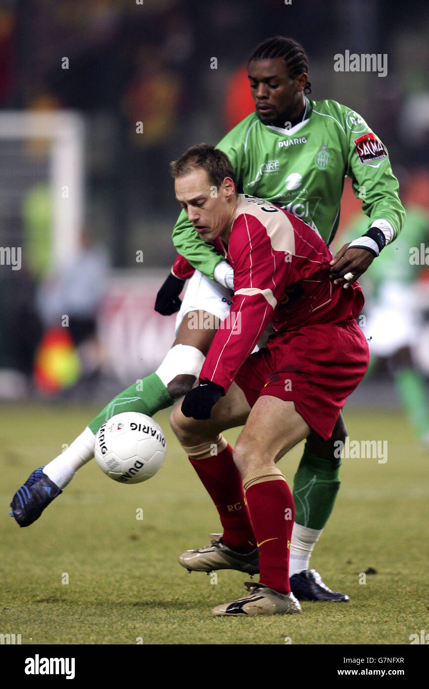 St Etienne's Frederic Piquionne and Lens' Nicolas Gillet battle for the ...