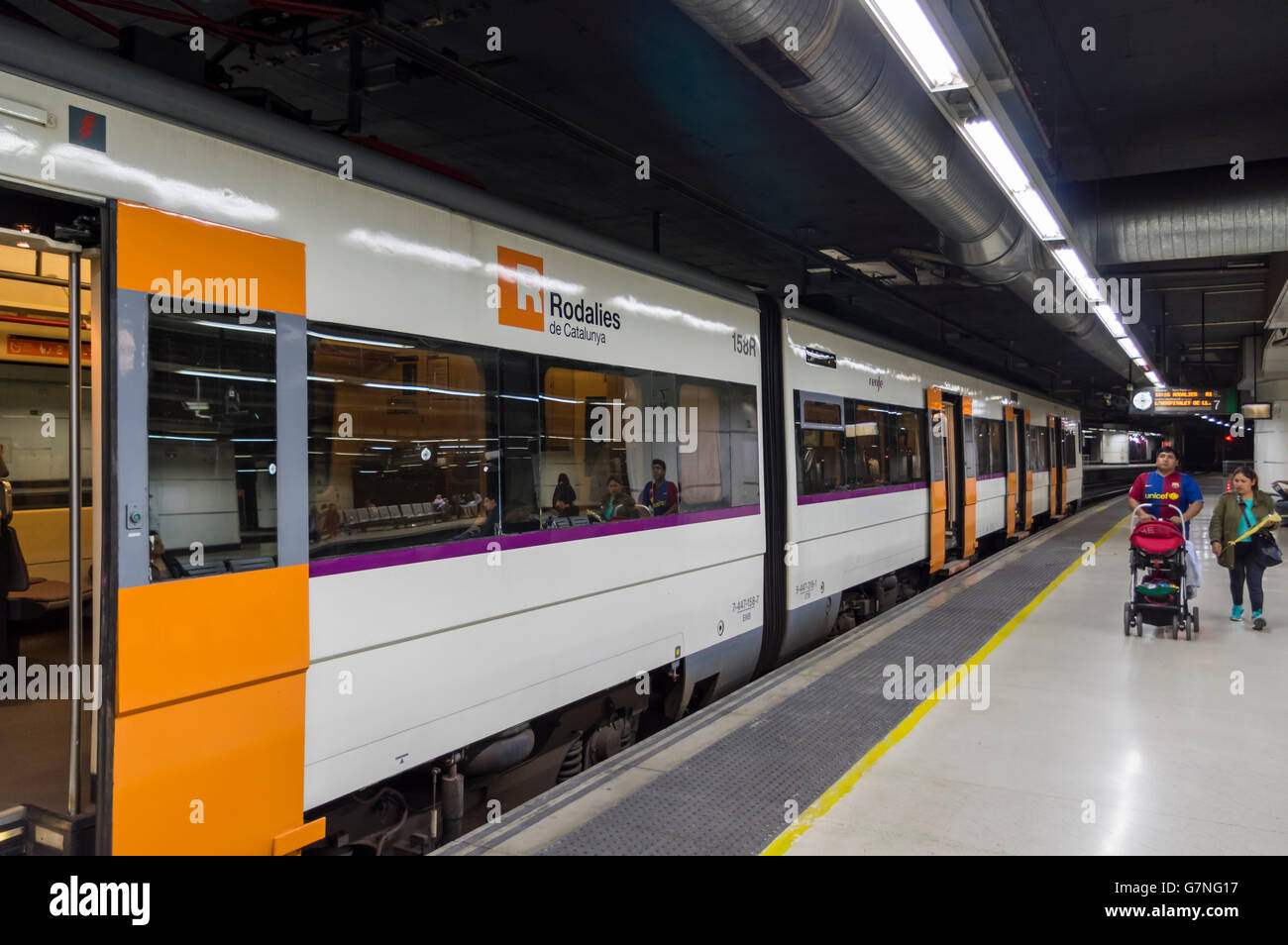 Regional train of Rodalies de Catalunya at an underground train station ...