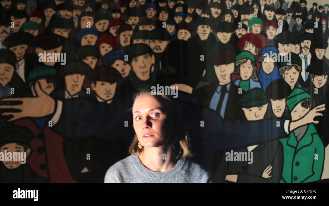 Intern Jenny Snook looks at a section of The 1913 Lockout Tapestry ...