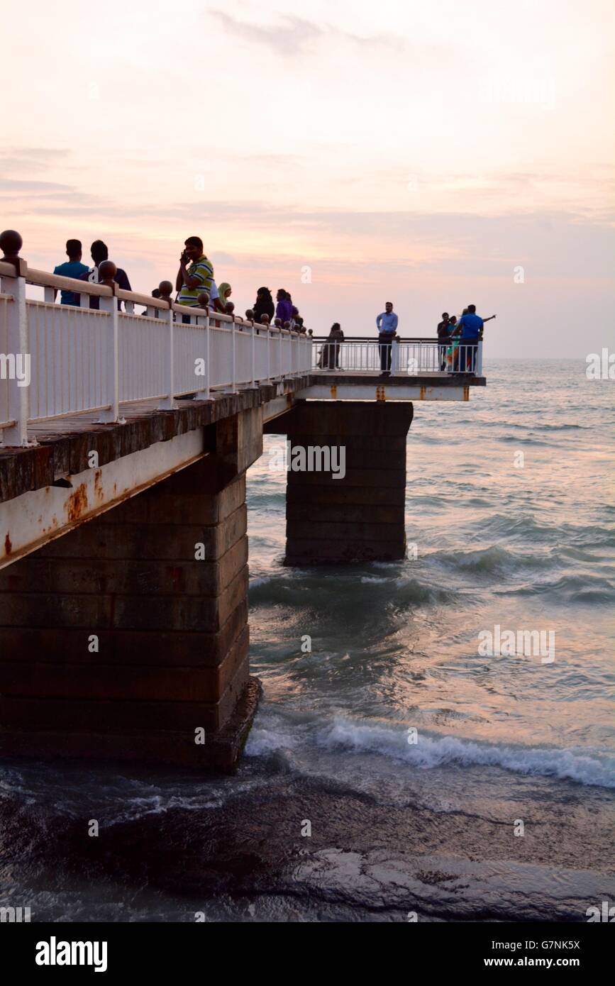 people on a jetty over the sea at galle face green, colombo, sri lanka ...