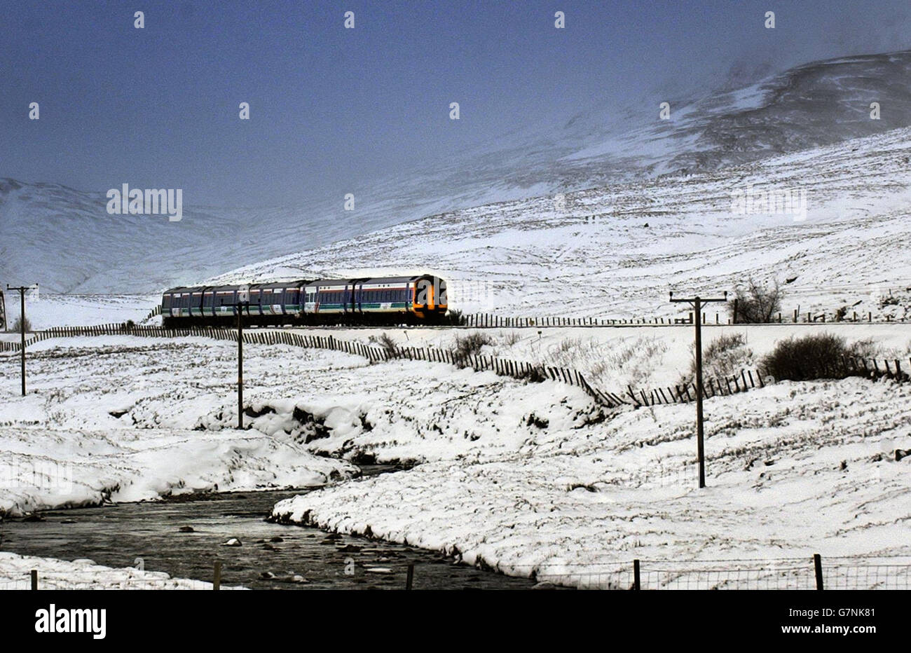 A scotrail train cuts its way through heavy snow hi-res stock ...
