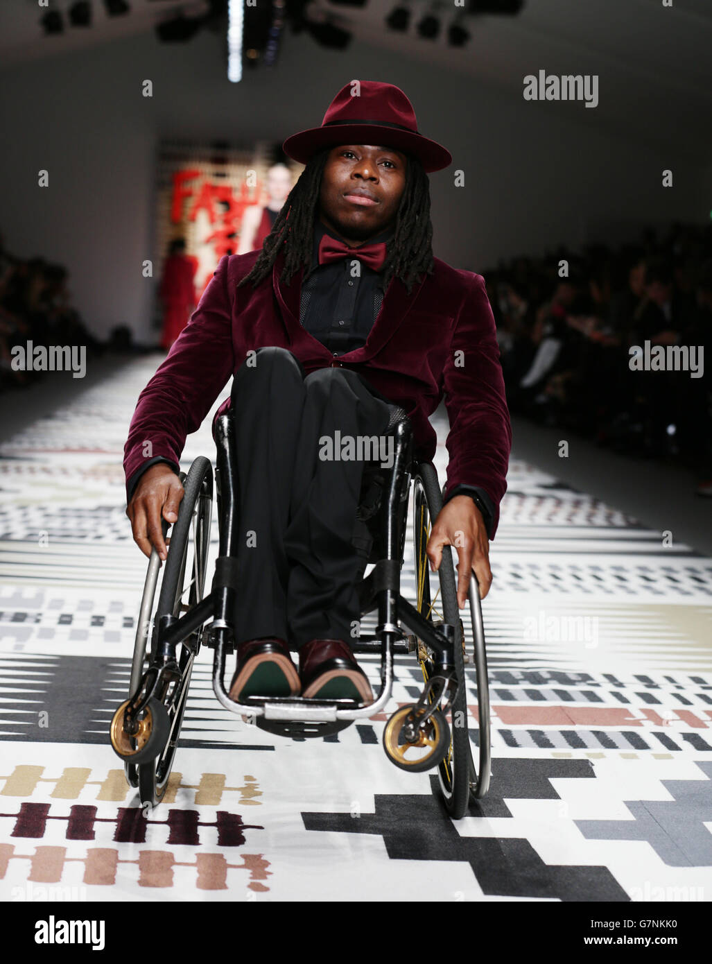 Ade Adepitan on the catwalk during the Fashion for Relief a charity ...