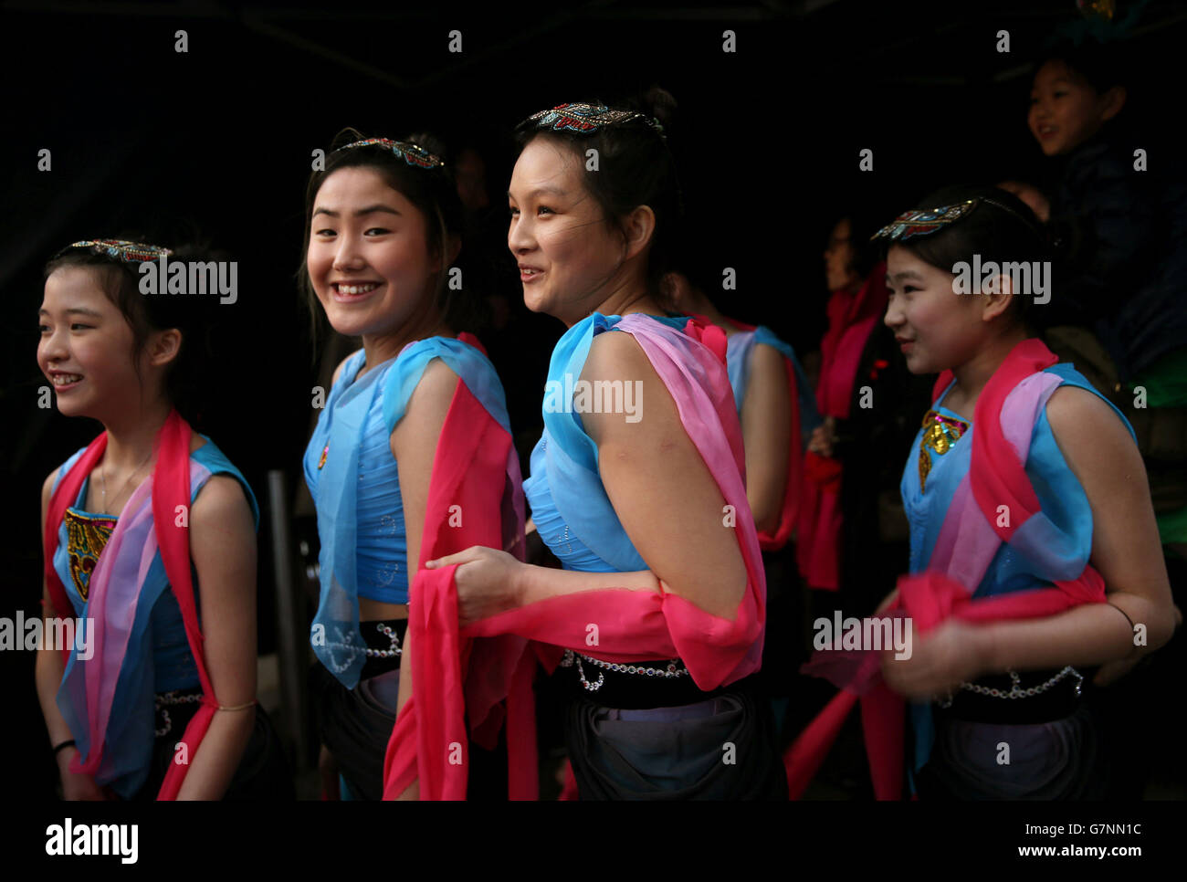 Performers from the Chinese Irish Culture Academy wait to take to the ...