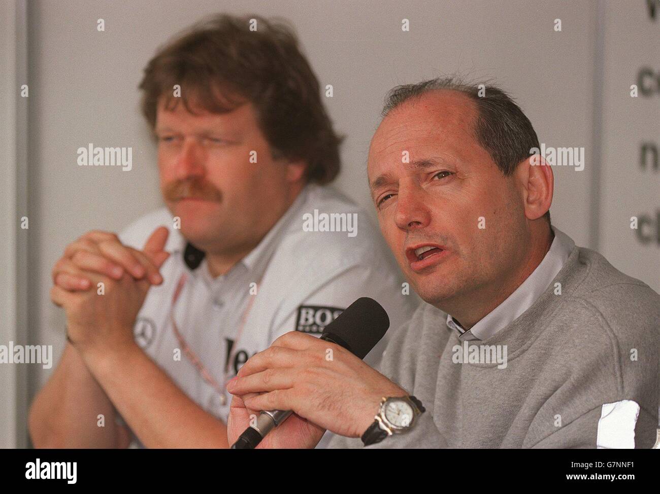 McLaren boss Ron Dennis (right) and Mercedes boss Norbert Haug talk to ...