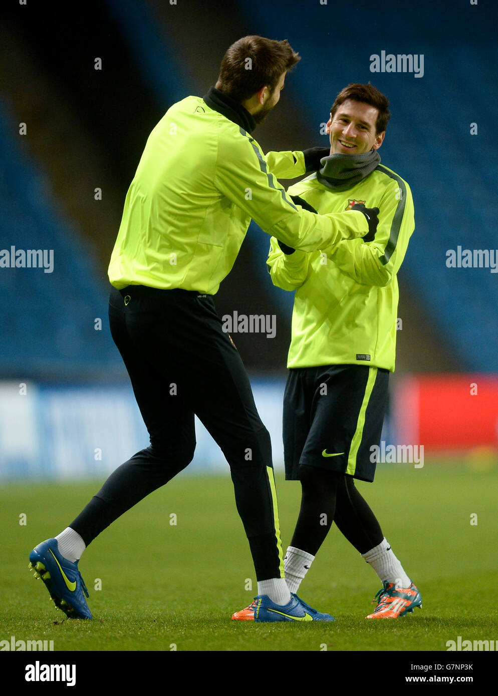 Barcelona's Lionel Messi (right) and Gerard Pique during a training ...
