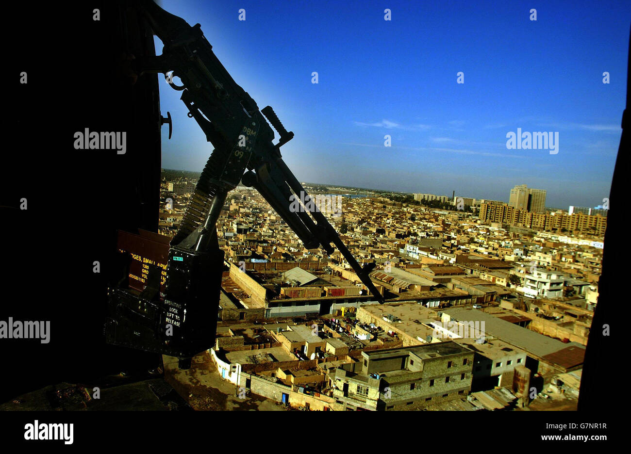 An RAF loadie keeps a watchful eye as he flies over Baghdad Stock Photo ...