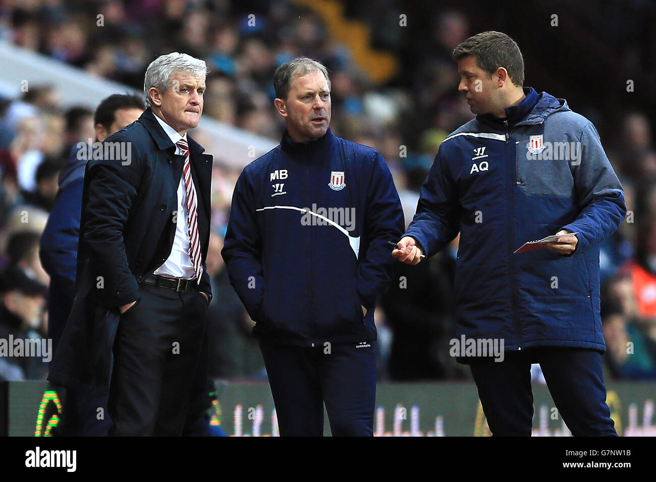 Stoke City manager Mark Hughes (left), assistant anager Mark Bowen ...
