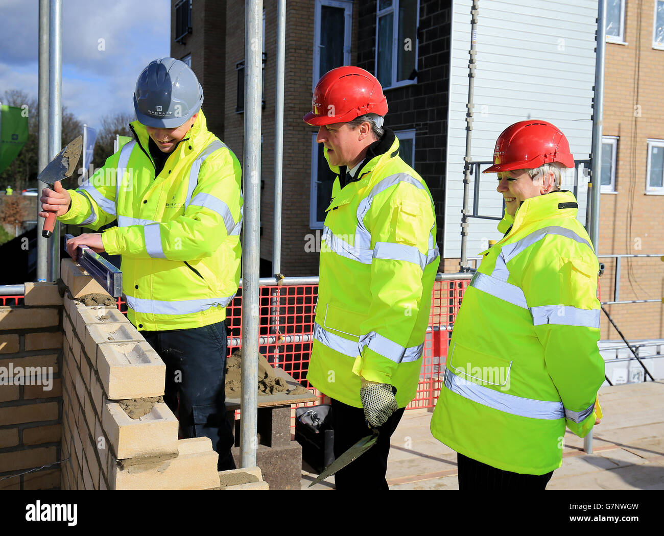 Prime Minister David Cameron is shown some brick laying by apprentice ...