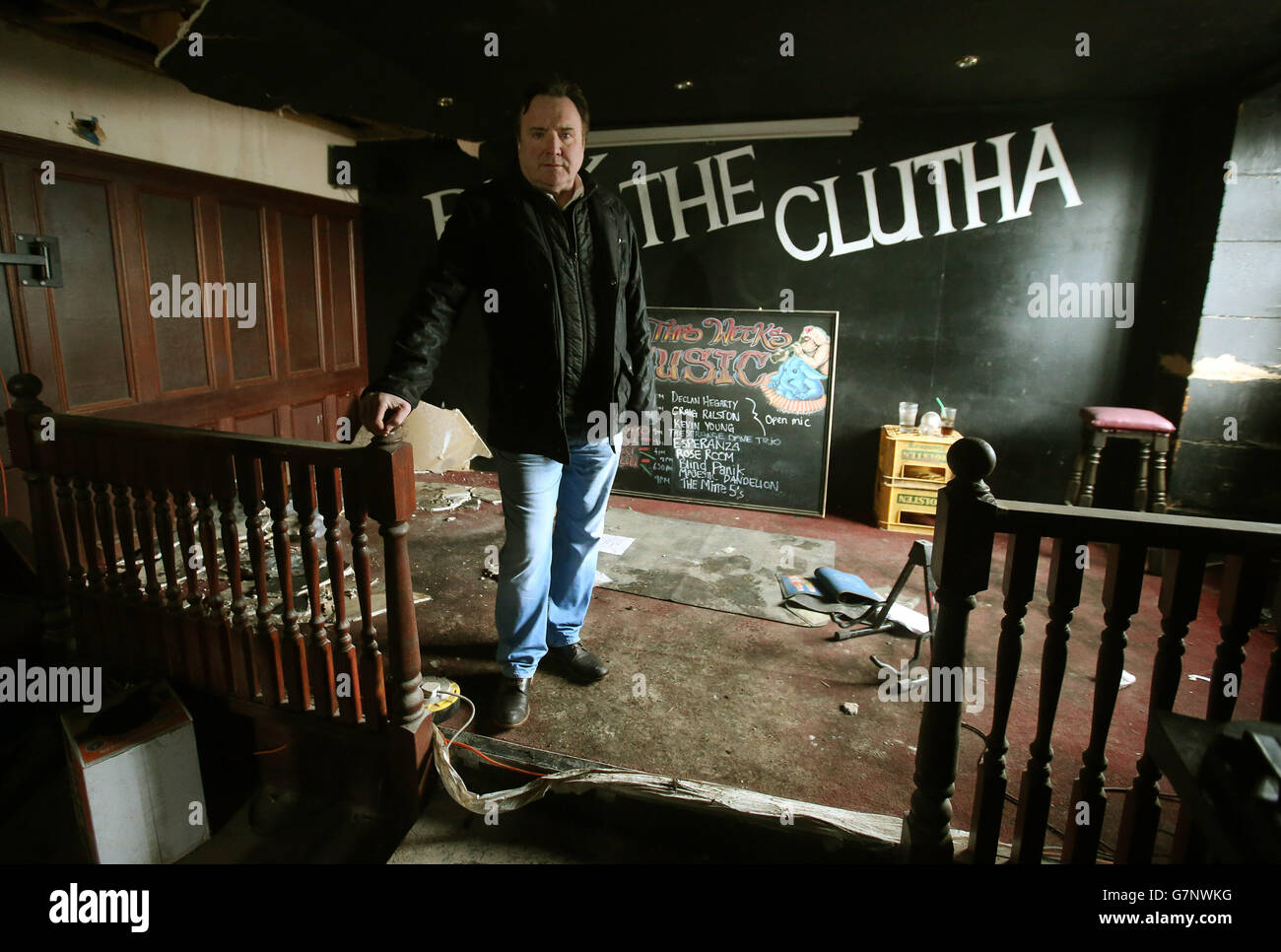 Owner Alan Crossan of the Clutha bar in Glasgow stands on the stage ...
