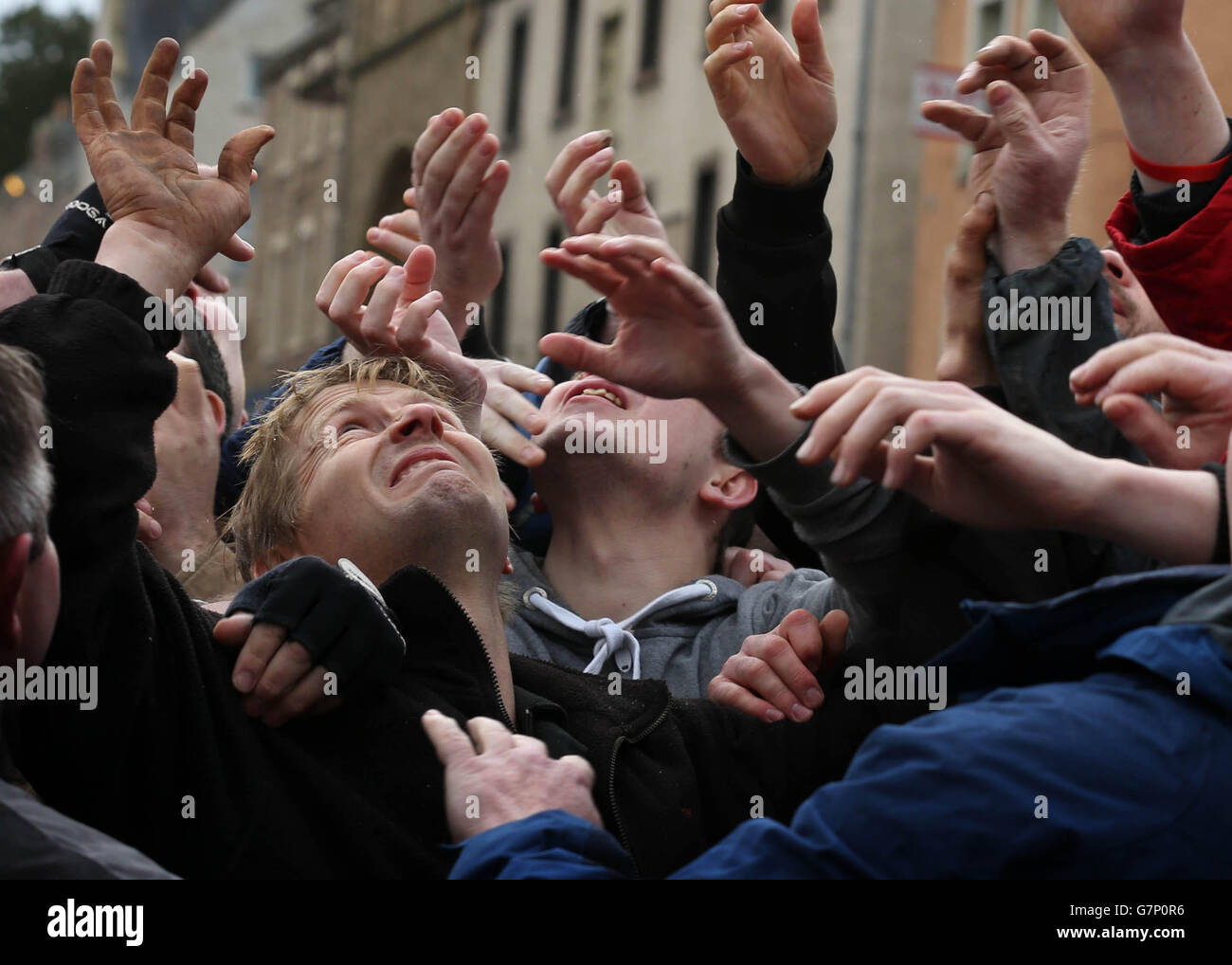 Players leap for the ball in the Hand Ba game, traditionally played on ...