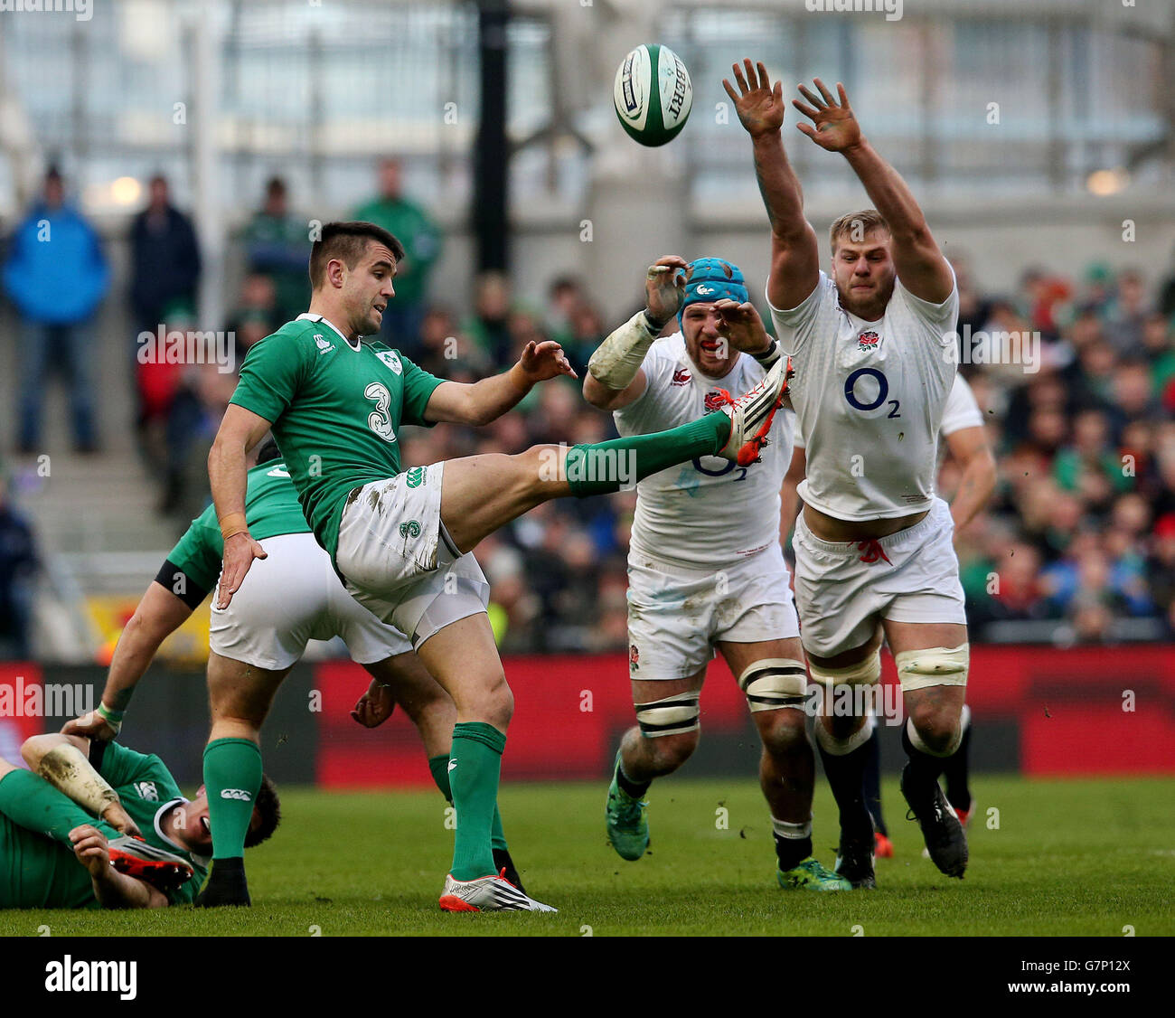 Ireland's Conor Murray kicks under pressure from England's George Kruis ...