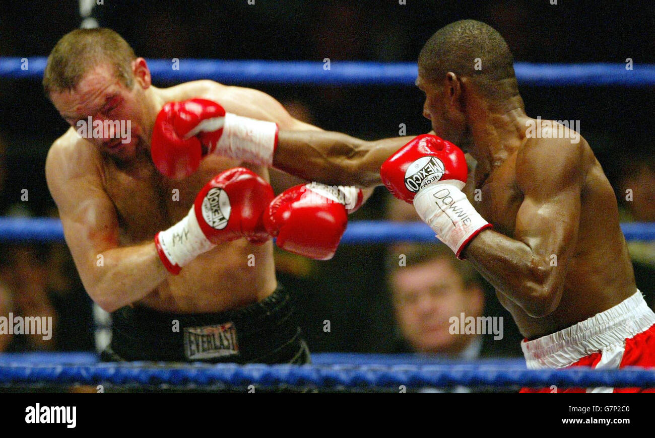 Scottish Scott Harrison takes a punch from Columbian Victor Polo during ...