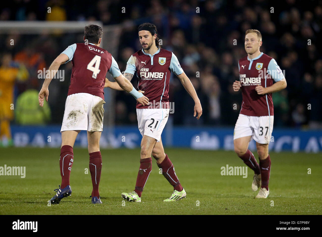Burnley's George Boyd (centre) celebrates with teammate Michael Duff ...
