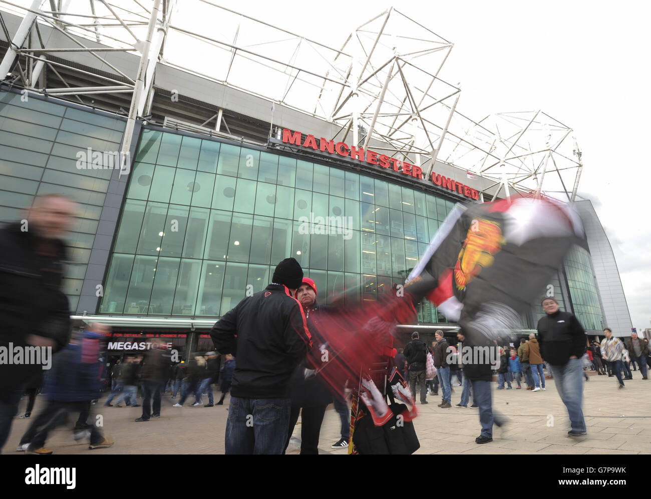 A street vendor sells flags to fans outside of Old Trafford prior to ...