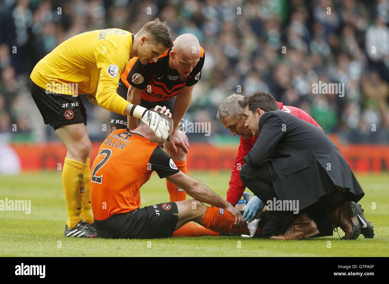 Dundee United's Sean Dillon receives medical attention during the QTS ...