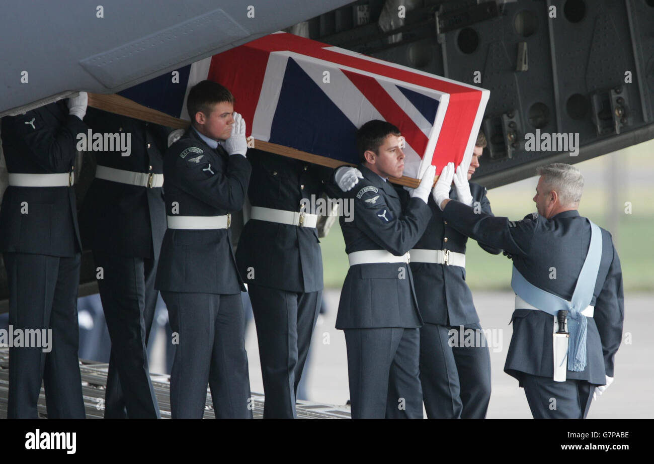 Service personnel carry the coffin of Flight Lieutenant David Stead as ...