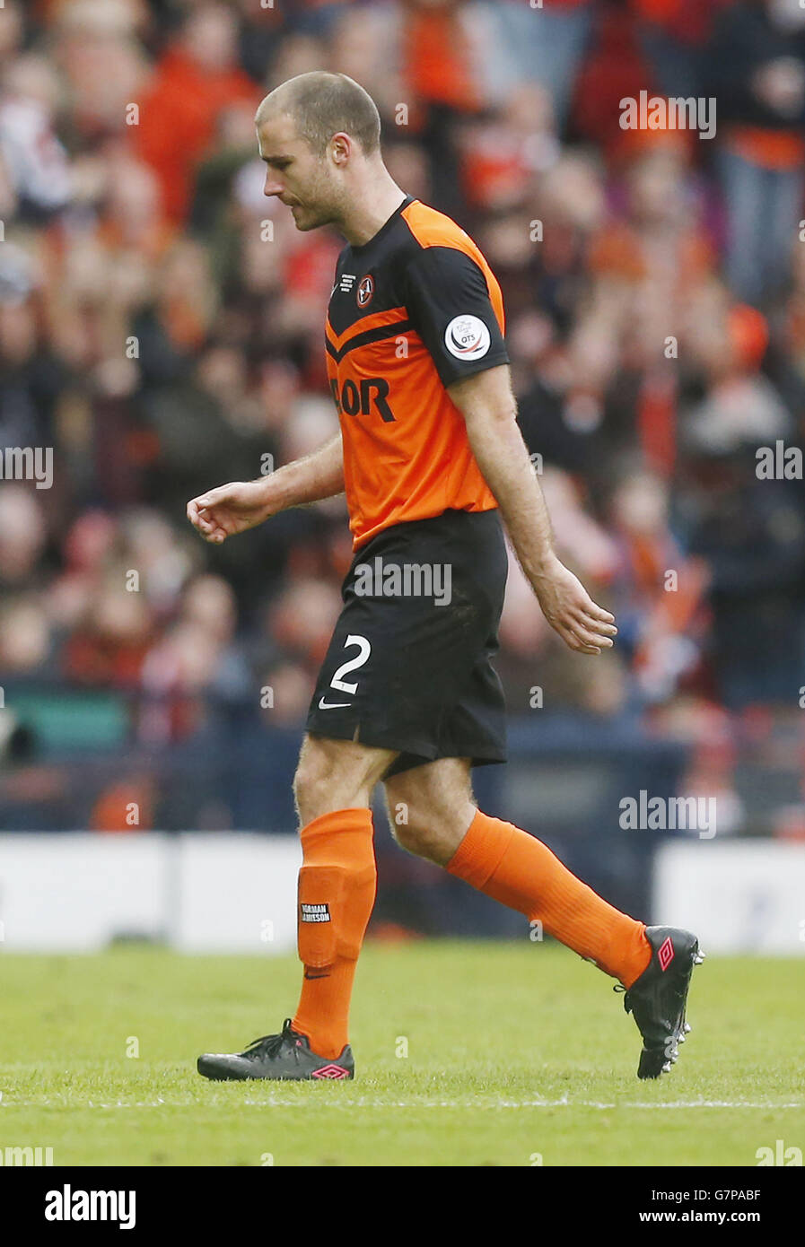 Dundee United's Sean Dillon walks off the pitch after receiving a red ...