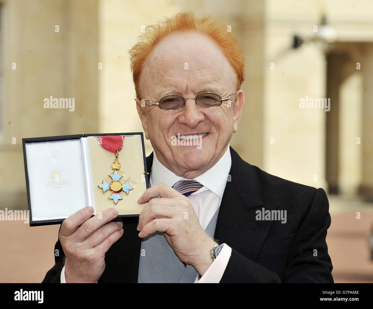 Musician, manager and record producer Peter Asher, holds his Commander ...
