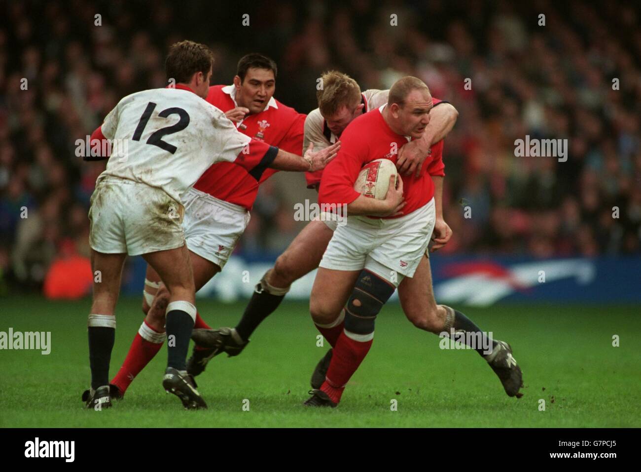 Craig Quinnell, Wales is tackled by Tim Rodber, England Stock Photo - Alamy