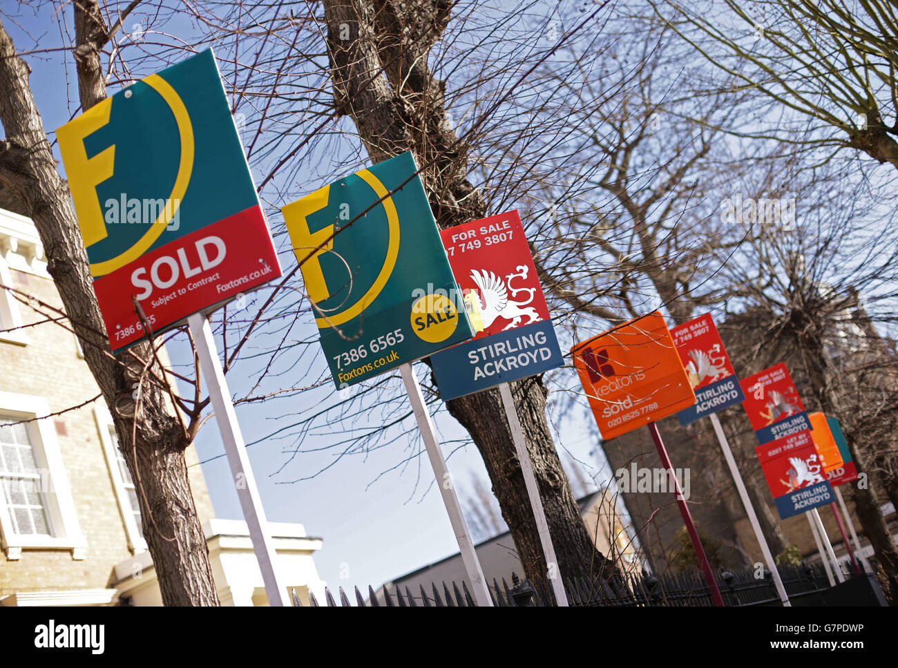 A row of Sold, For Sale and Let By signs displayed outside houses in ...