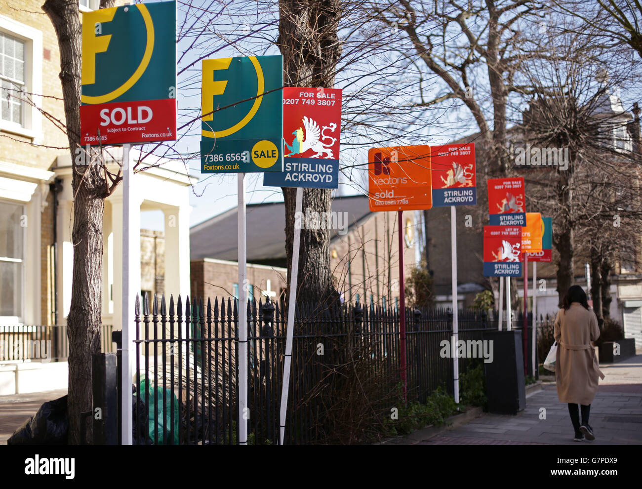 A row of Sold, For Sale and Let By signs displayed outside houses in ...