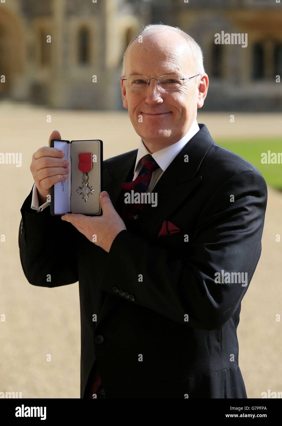 Andrew wallis receives an mbe at windsor castle hi-res stock ...