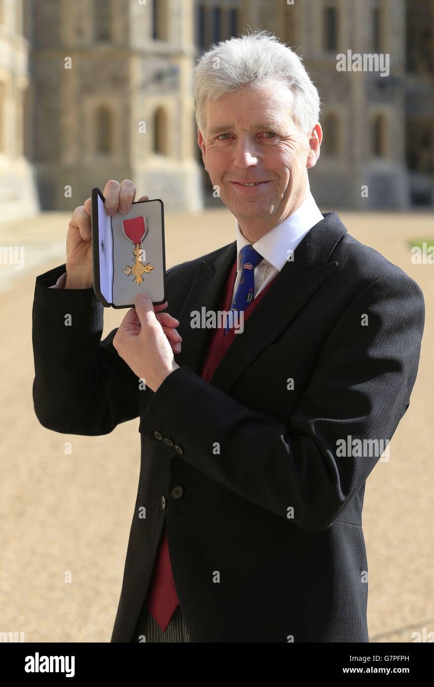 Investiture ceremony at Windsor Castle. Edward Gillespie receives an ...