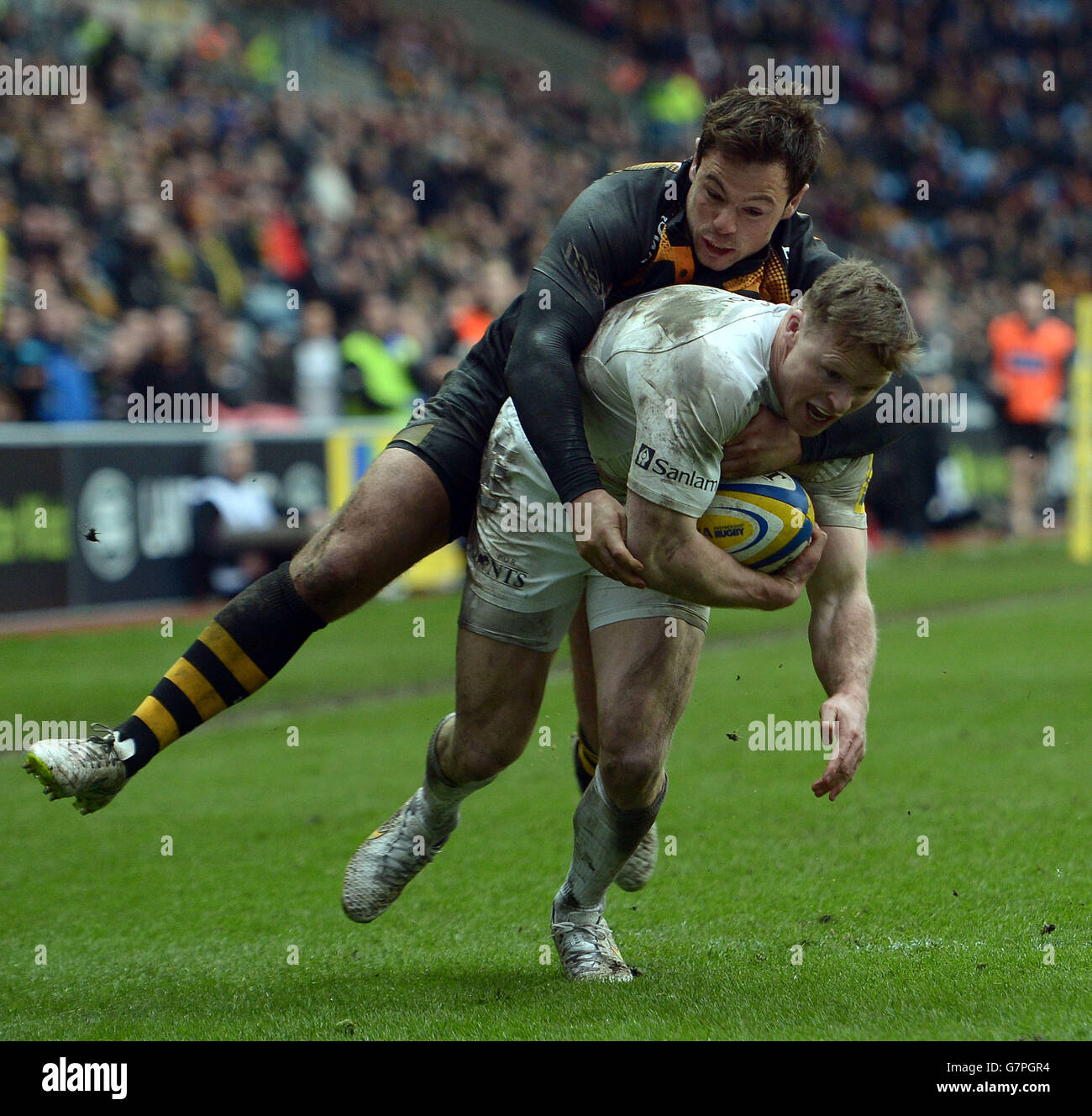 Wasps' Rob Miller stops Saracens' Chris Ashton during the Aviva ...