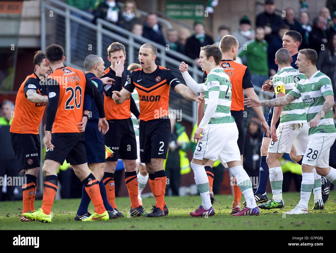 Referee Craig Thomson speaks with players from both teams before ...