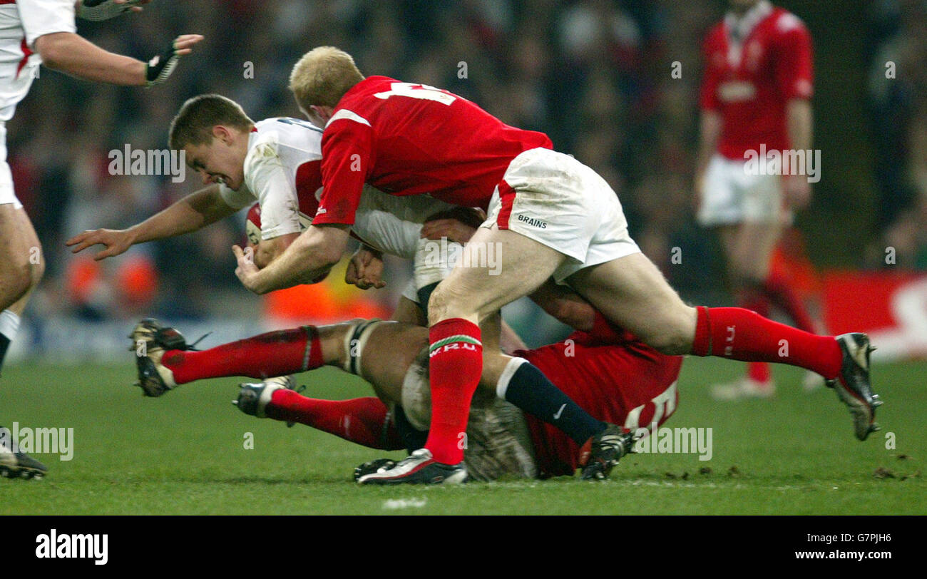 Wales' Robert Sidoli and Tom Shanklin tackle England's Mathew Tait ...