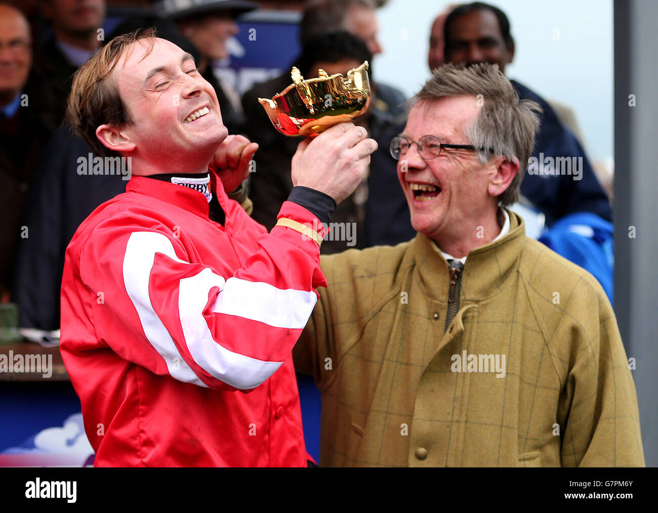 Jockey Nico de Boinville with the trophy and trainer Mark Bradstock ...