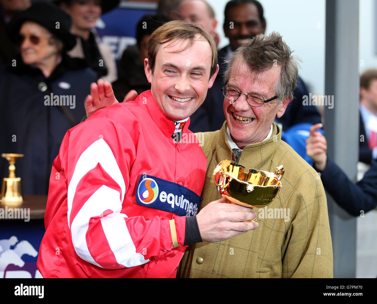 Jockey Nico de Boinville with the trophy and trainer Mark Bradstock ...