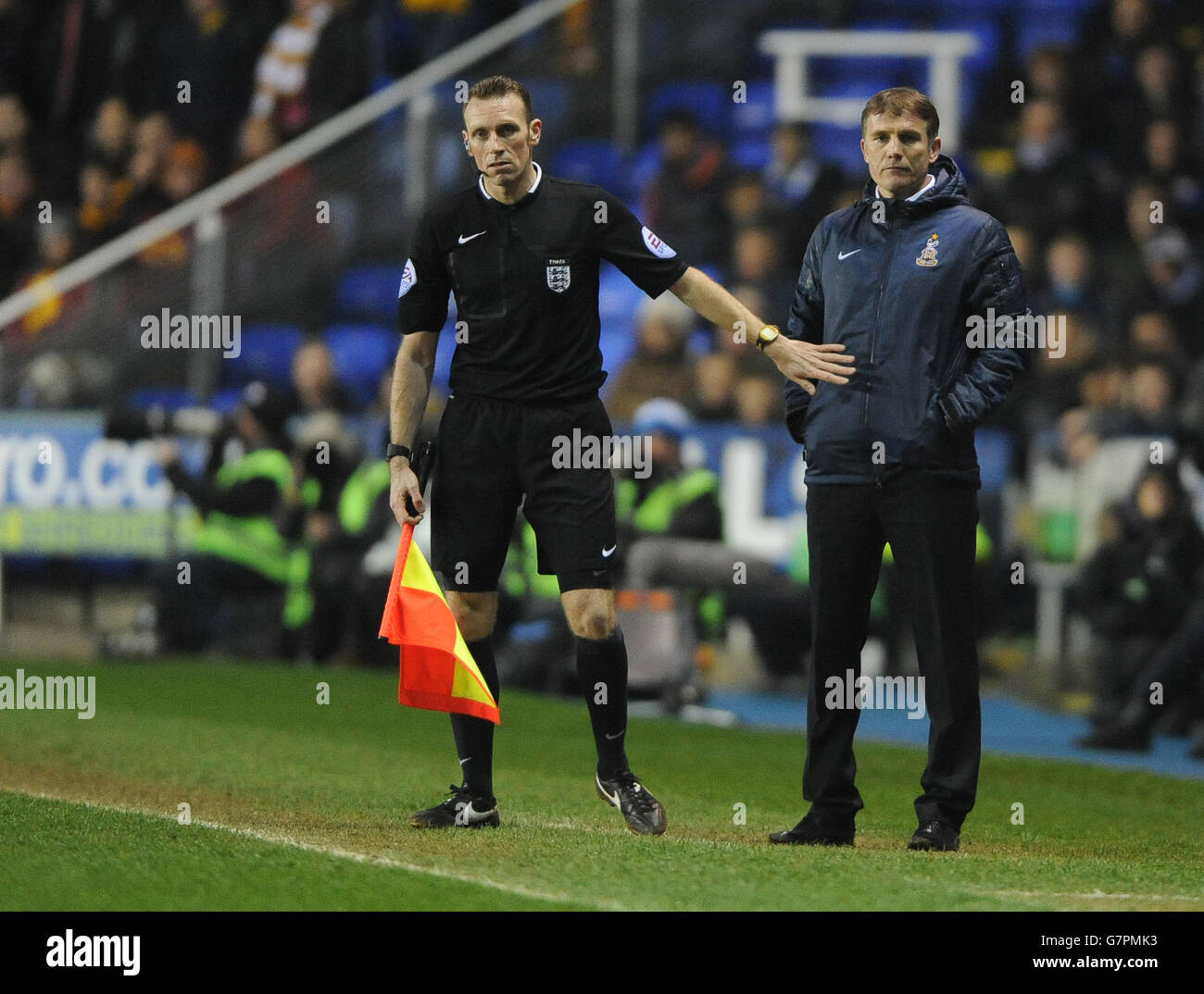 Bradford manager Phil Parkinson is spoken to by the assistant referee ...