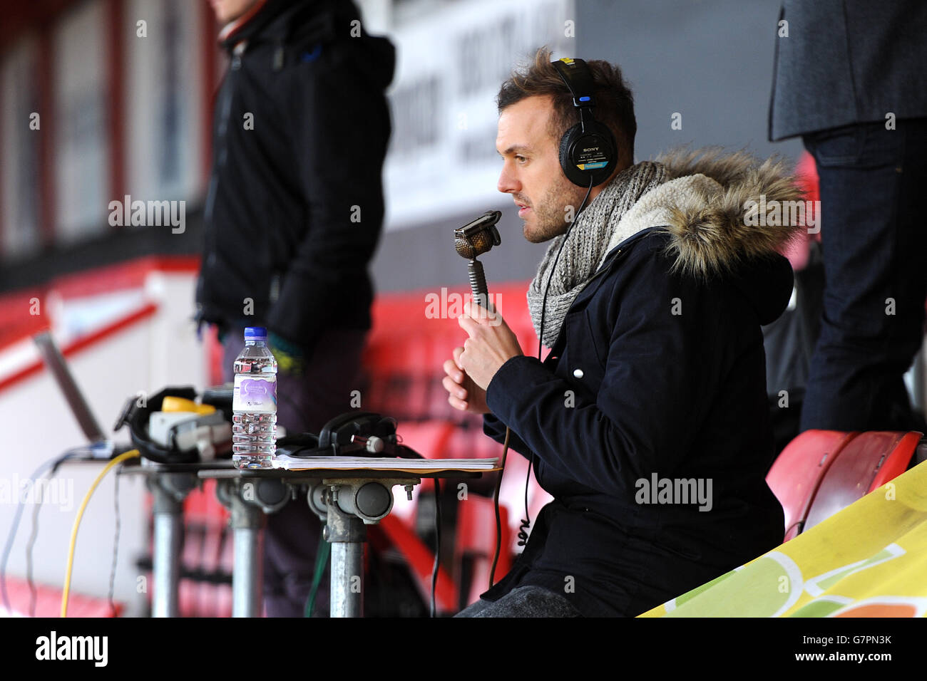 A radio commentator in the stands at the Goldsands Stadium Stock Photo ...
