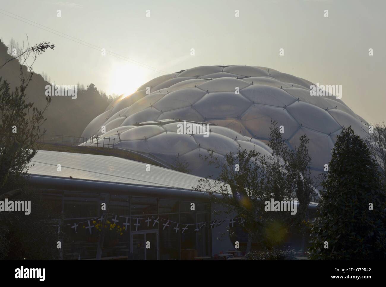 The sun rises over the Eden Project near St Austell in Cornwall, as a ...