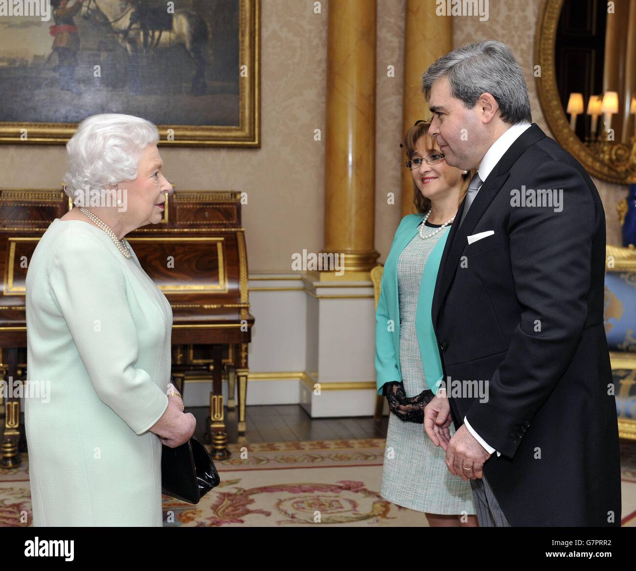Queen Elizabeth II (left) talks with His Excellency Mr Fernando Lopez ...