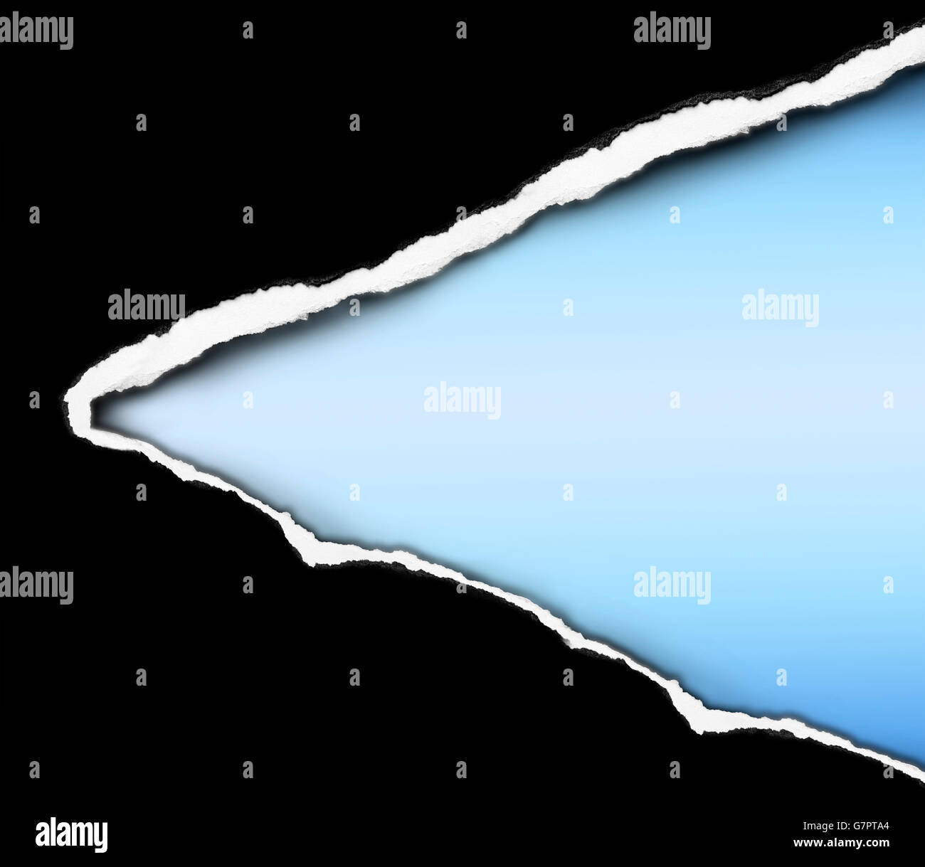 Hole ripped in paper on blue background Stock Photo - Alamy