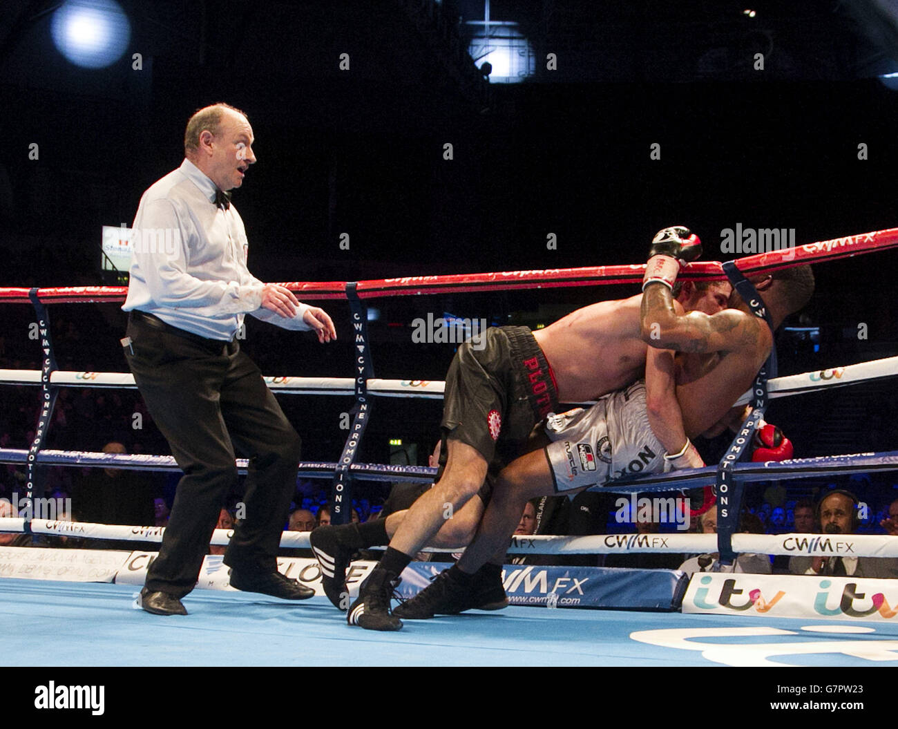 Boxing - Odyssey Arena. Denton Vassell (right) and Viktor Plotnikov tumble into the ropes during ...